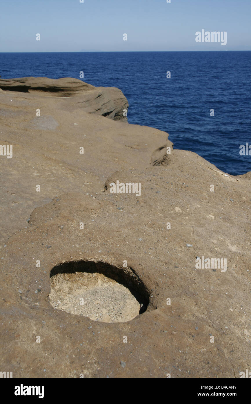 pattern on eroded volcanic rock formation on coast at venotene, italy ...