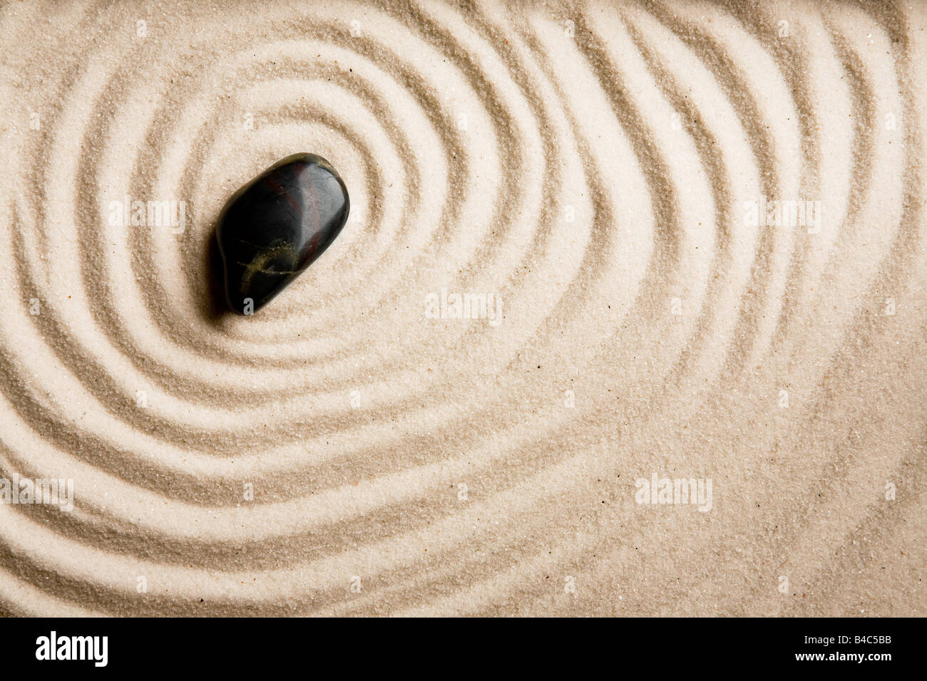 A circular sand swirl background texture abstract Stock Photo - Alamy