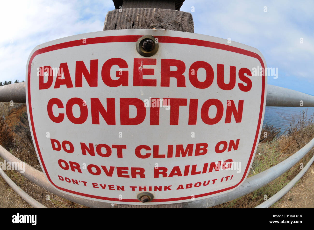 Dangerous condition sign on ocean bluff Stock Photo - Alamy