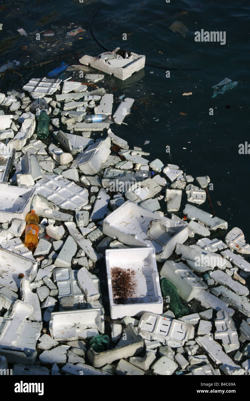 lots of plastic boxes floating on polluted river surface Stock Photo ...