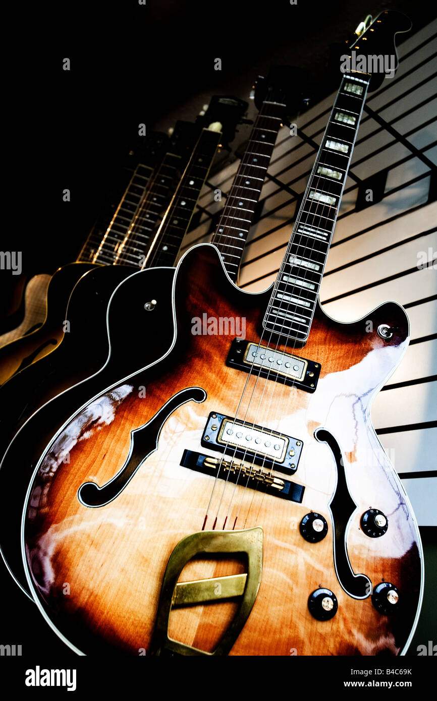 Guitars in music store Stock Photo - Alamy
