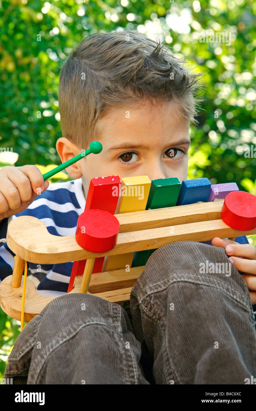 Playing an instrument kid shy hi-res stock photography and images - Alamy