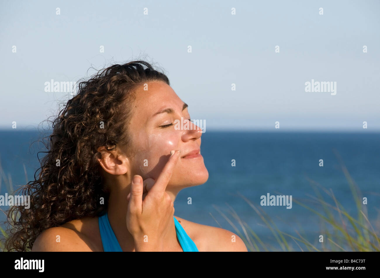 Woman protecting from sun hi-res stock photography and images - Alamy