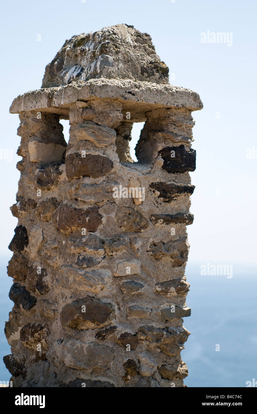 Traditional Italian square stone chimney stack and vent Stock Photo - Alamy