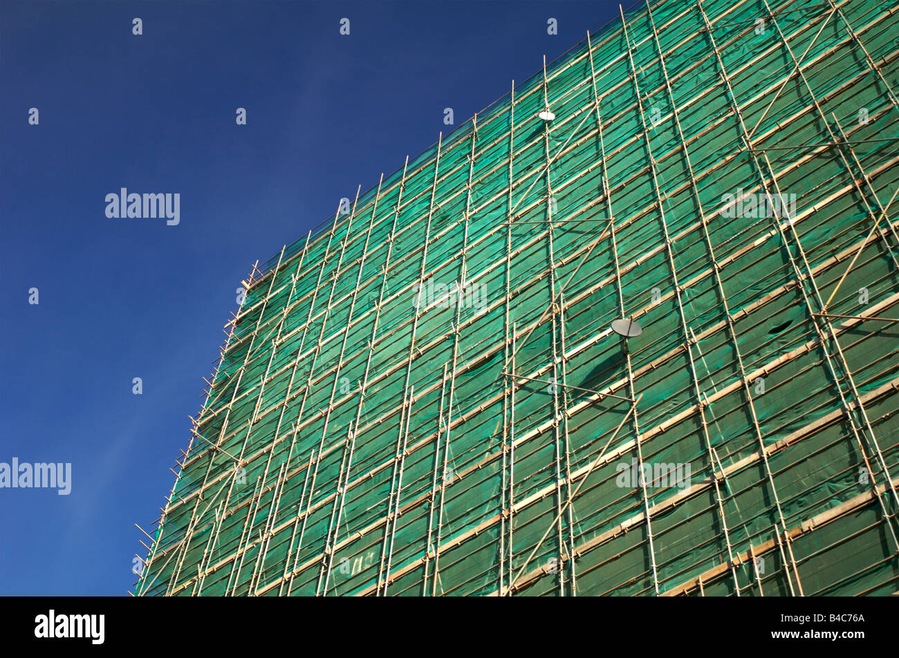 A tower block clad in scaffolding Stock Photo - Alamy