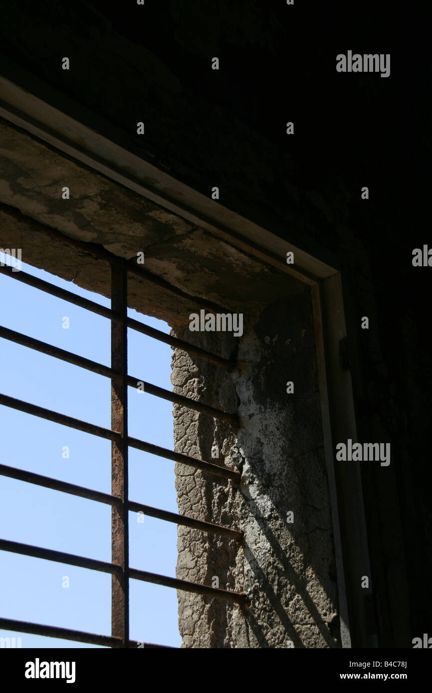one high dark prison cell window with metal bars Stock Photo - Alamy