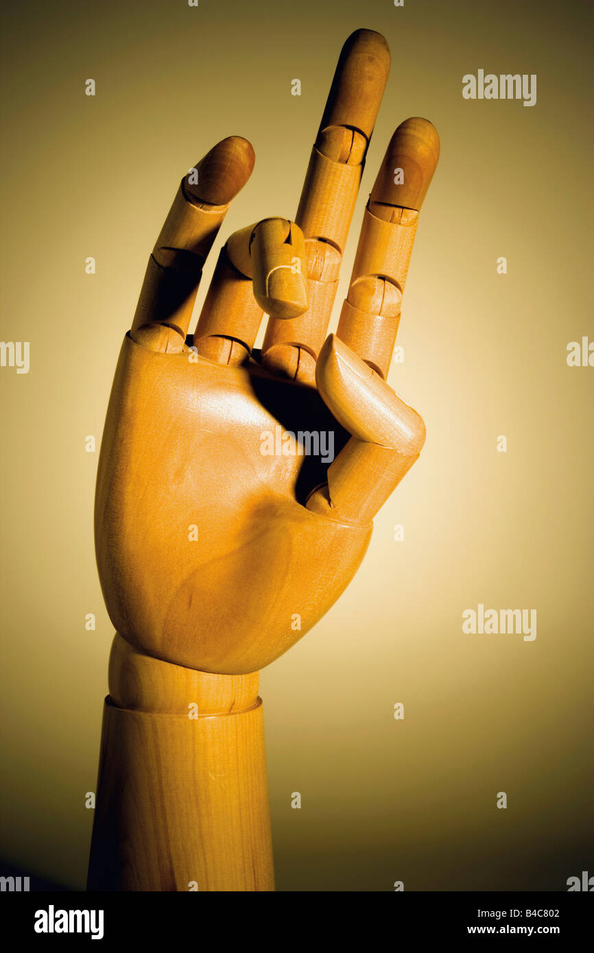 Wooden mannequin hand with jointed fingers Stock Photo - Alamy