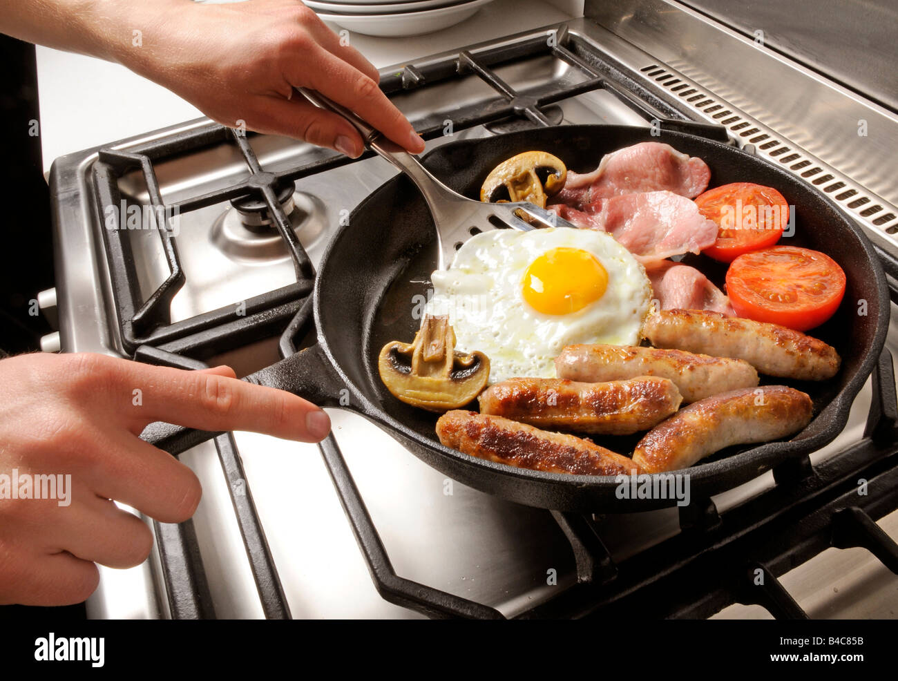 MAN COOKING FRIED BREAKFAST Stock Photo - Alamy