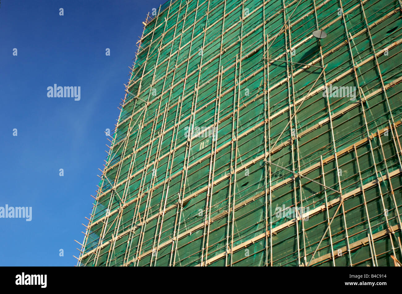 A tower block clad in scaffolding Stock Photo - Alamy