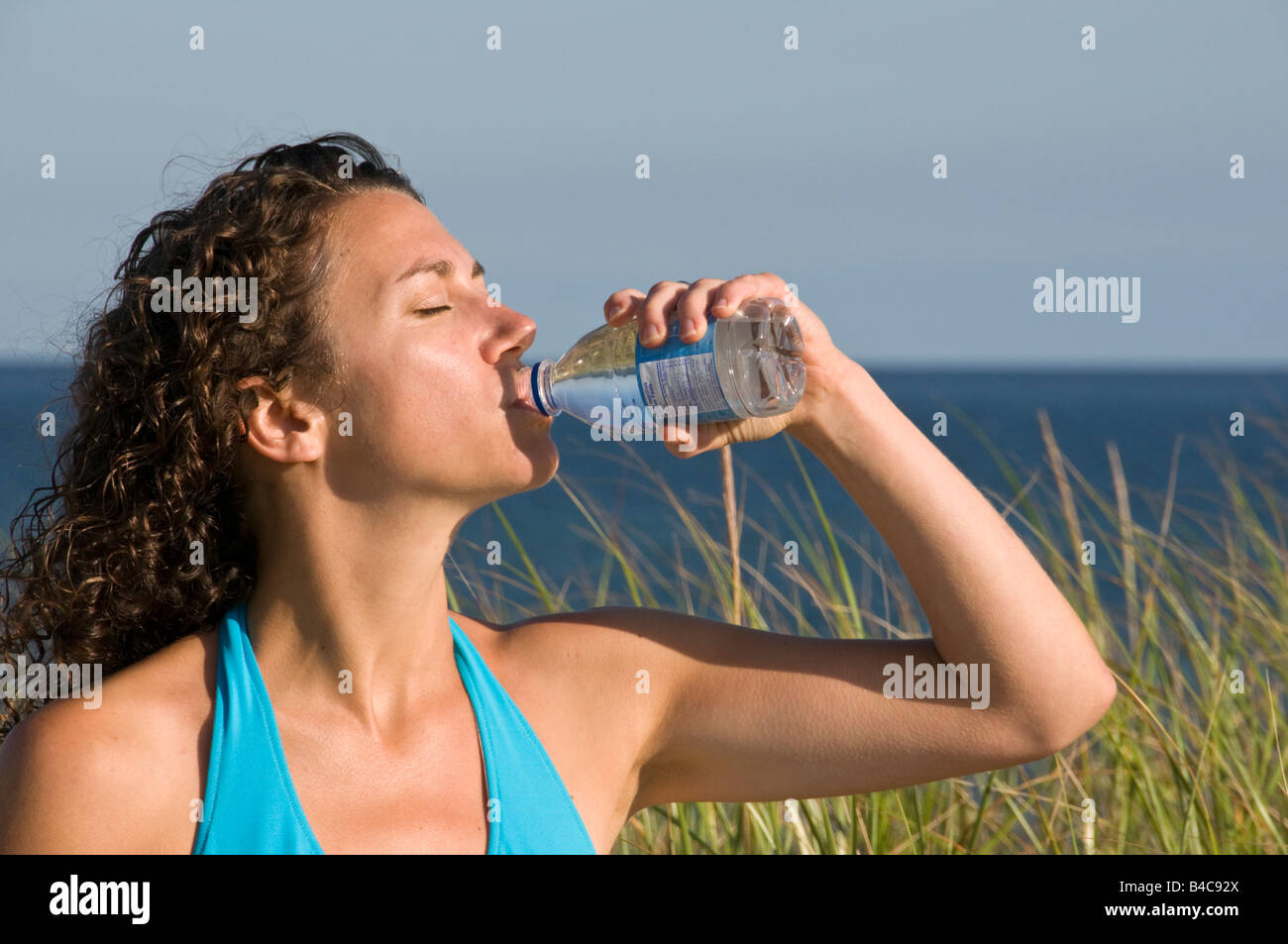 Woman drinking water Stock Photo - Alamy