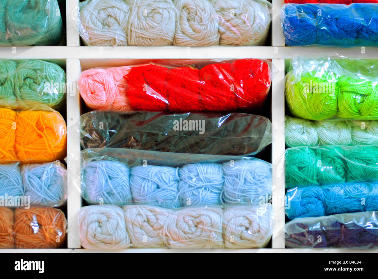 colorful shelving full of wool Stock Photo - Alamy