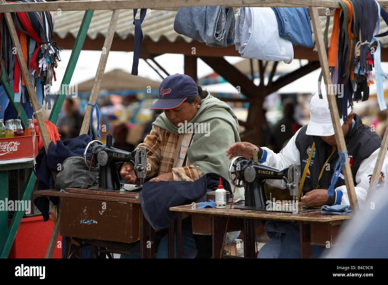 Native sewing, Saquisili Market, Andes Mountains, Ecuador Stock Photo ...