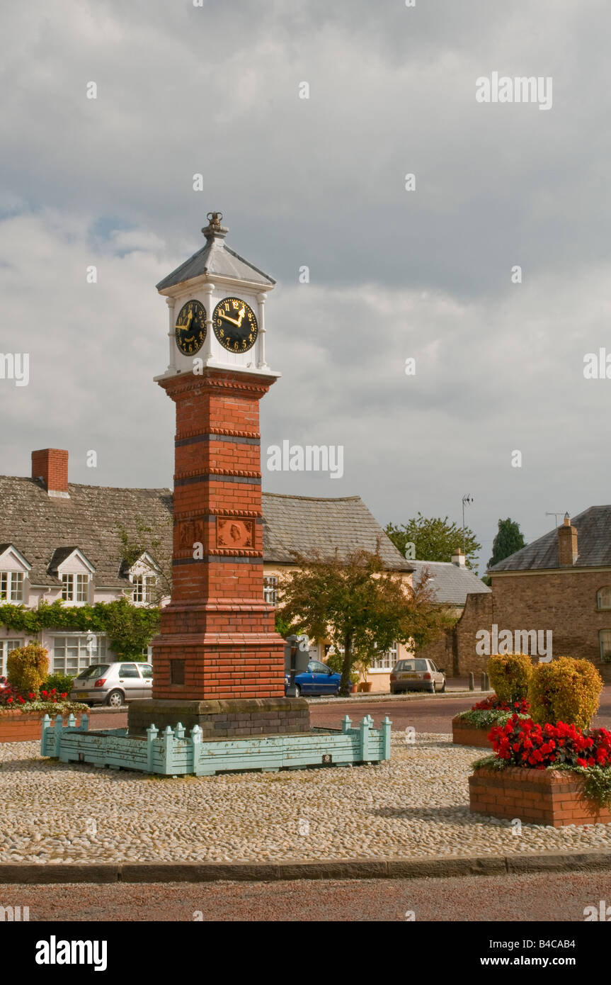 Red brick clock tower in the middle of the welsh town of Usk in ...