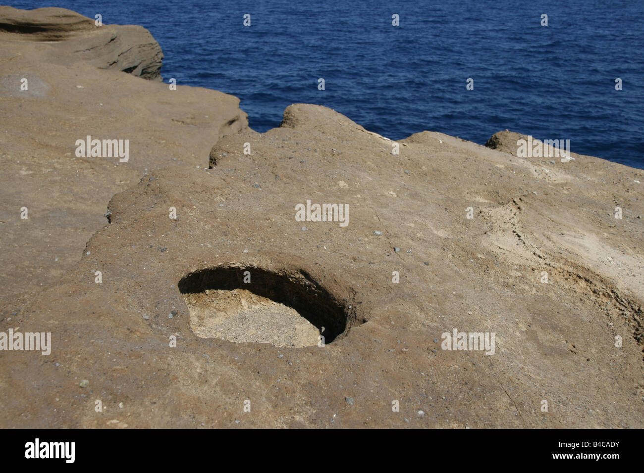 pattern on eroded volcanic rock formation on coast at venotene, italy ...