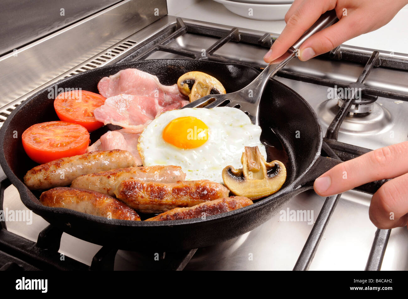 MAN COOKING FRIED BREAKFAST Stock Photo - Alamy