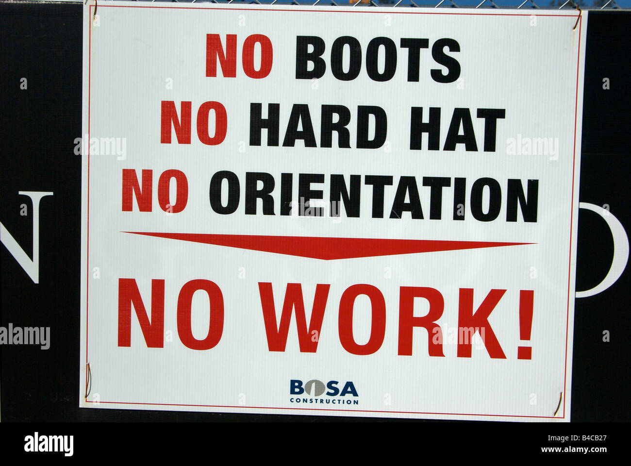 Condominium construction site warning sign with safety workwear rules ...