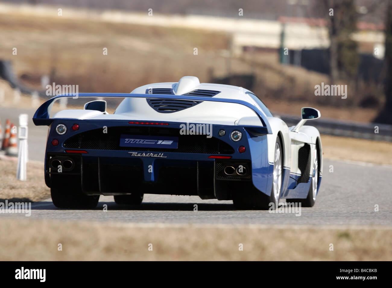 Car Maserati MC 12 Roadster Model Year 2004 White blue Moving Car Maserati MC 12 Roadster Model Year 2004 White blue Moving