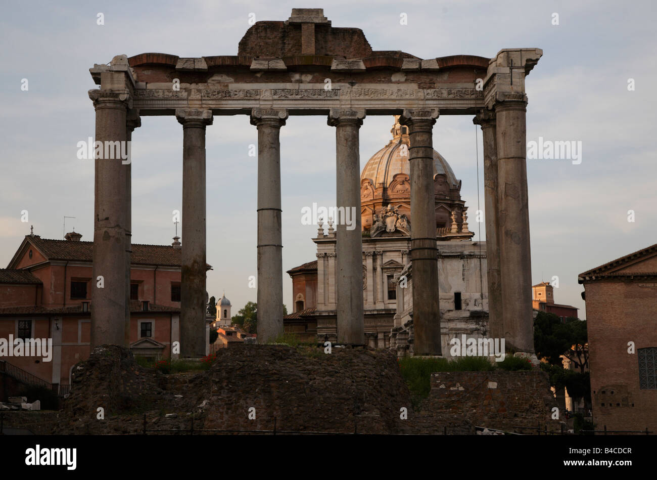 columns of Temple of Saturn in Roman forum and church of Saint Luck and ...