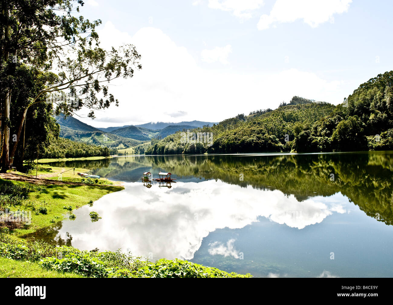 Dramatic scenery of mirror reflections of mountains, forest, sky ...