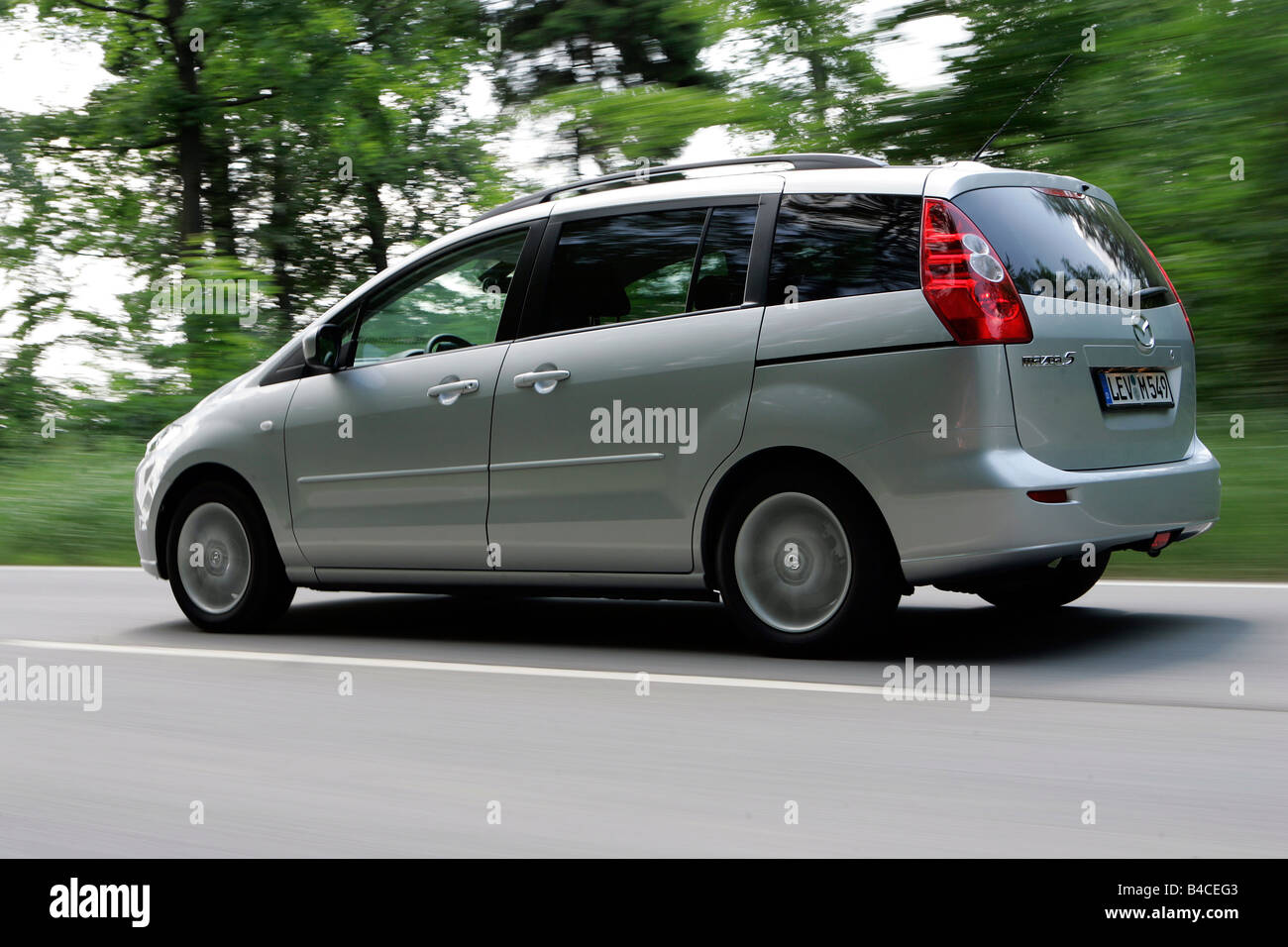 Car, Mazda 5 2.0 MZR, model year 2005-, silver, driving, diagonal from ...