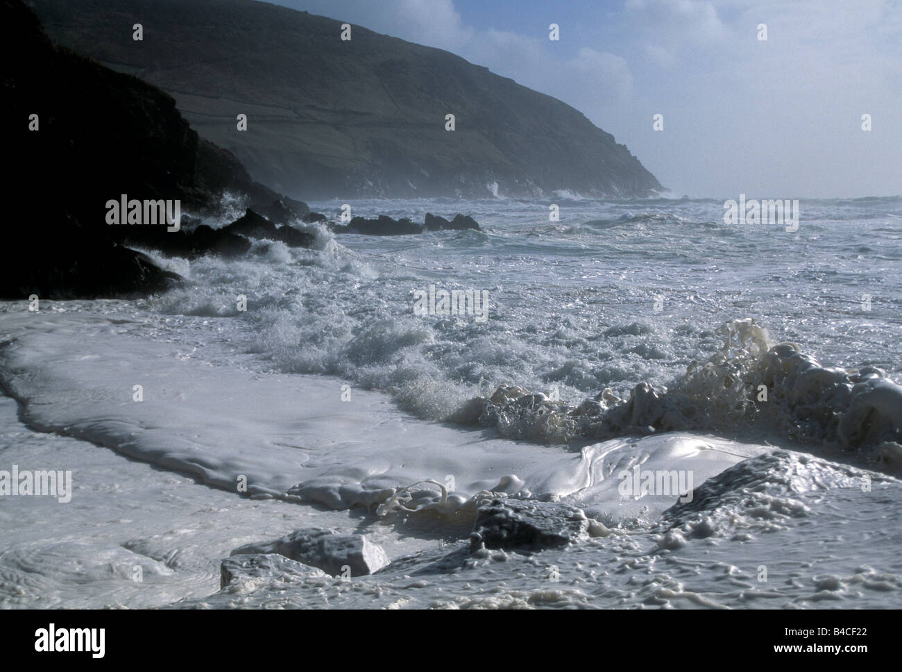 storm force waves crashing onto high cliffs on the verge of the ...