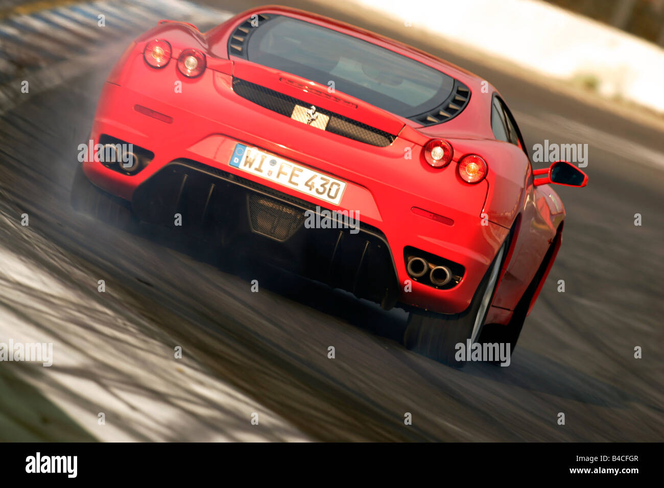 Ferrari F 430, model year 2005-, red, driving, diagonal from the back ...
