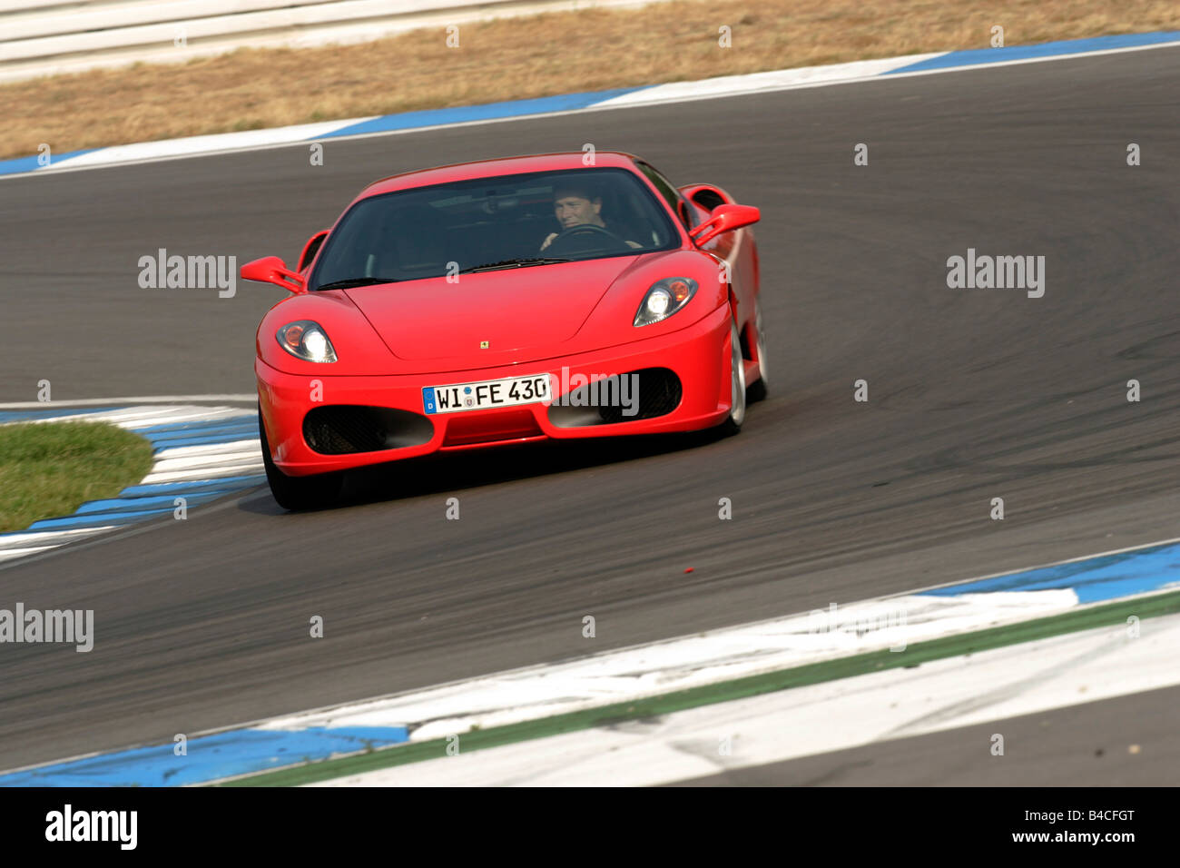 Ferrari F 430, model year 2005-, red, driving, diagonal from the front ...