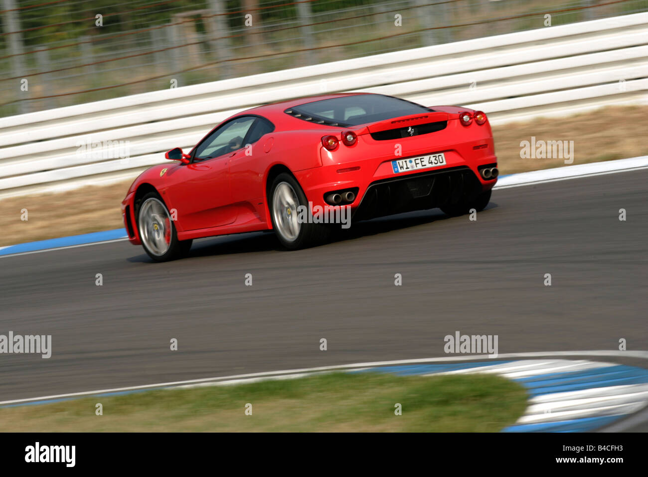 Ferrari F 430, model year 2005-, red, driving, diagonal from the back ...