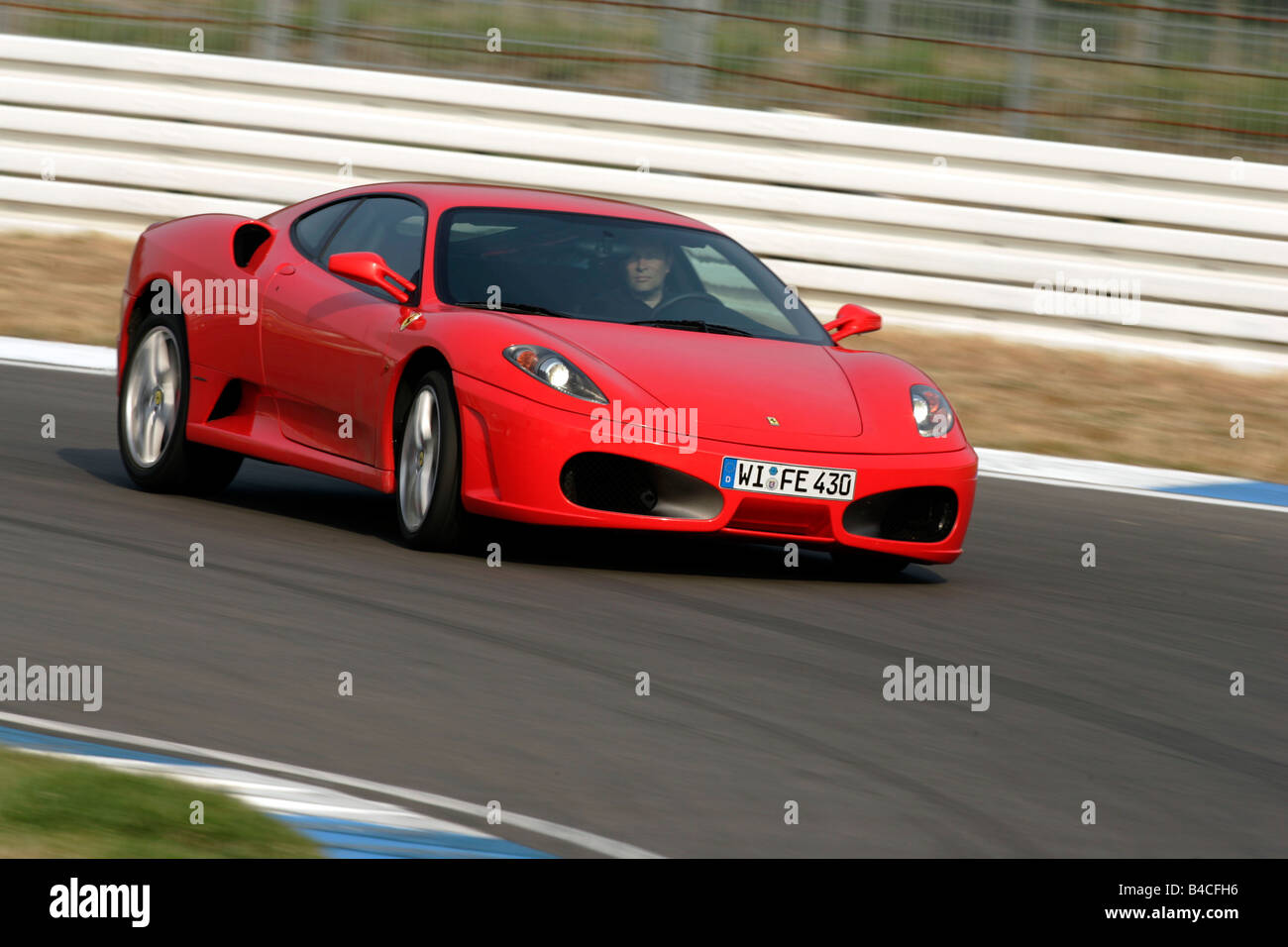 Ferrari F 430, model year 2005-, red, driving, diagonal from the front ...