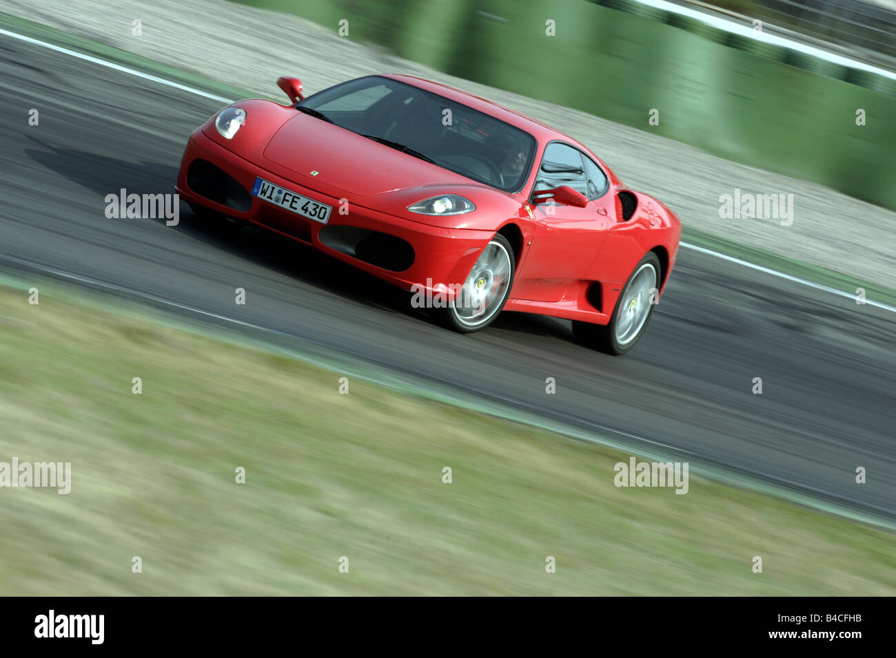 Ferrari F 430, model year 2005-, red, driving, diagonal from the front ...