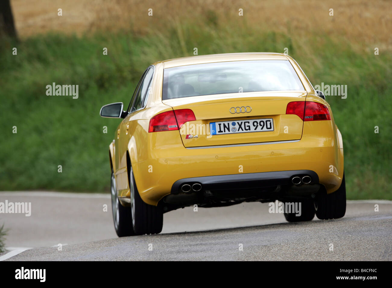 Audi S4, model year 2005-, yellow, driving, diagonal from the back ...