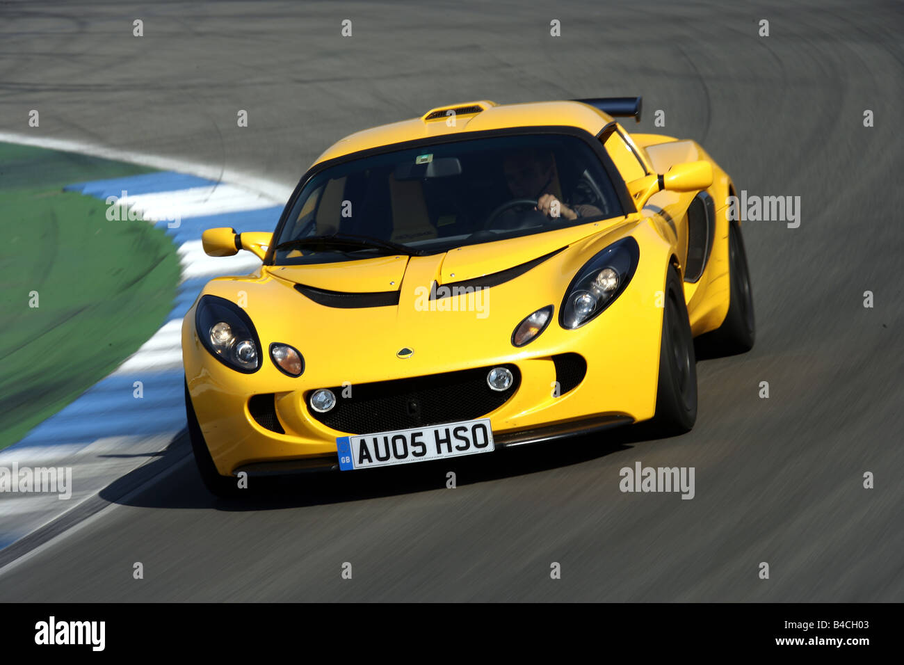 Lotus Exige 240R, model year 2005-, yellow, driving, diagonal from the ...