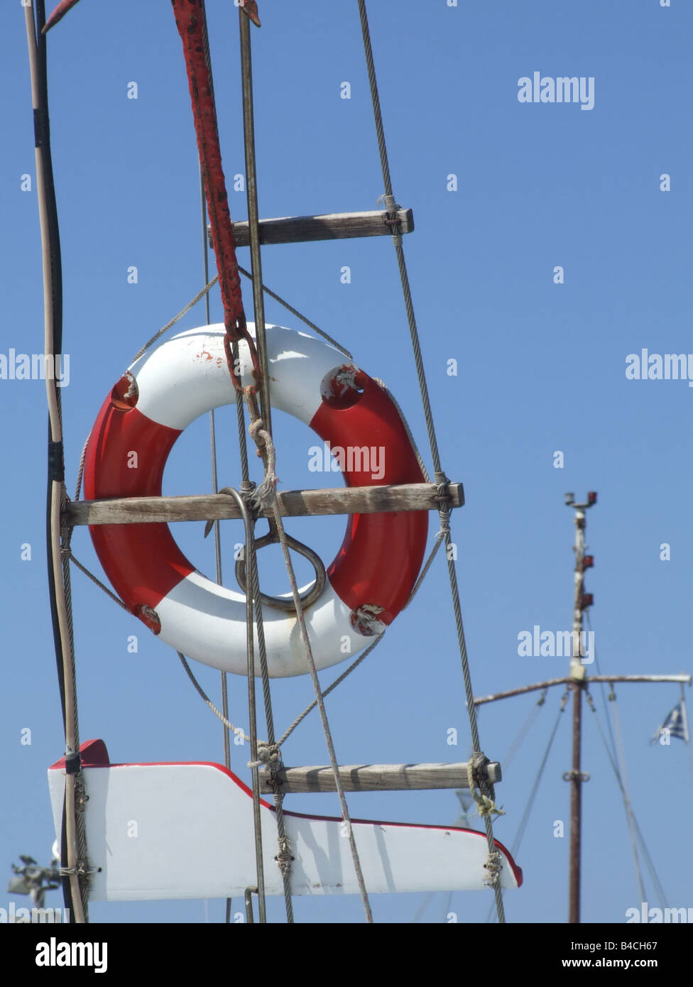 life saving rubber ring on ship and blue sky Stock Photo - Alamy