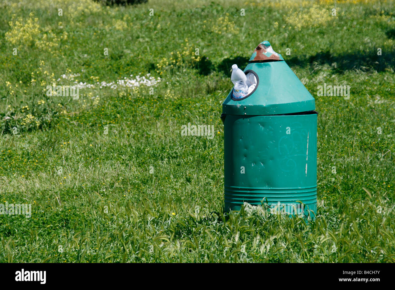 one full green litter bin in countryside Stock Photo - Alamy