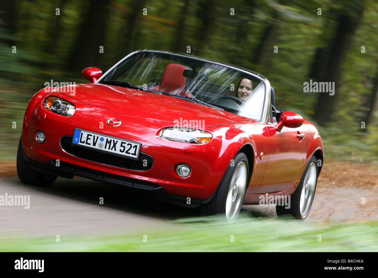 Mazda MX-5, model year 2005-, red, open top, driving, diagonal from the ...