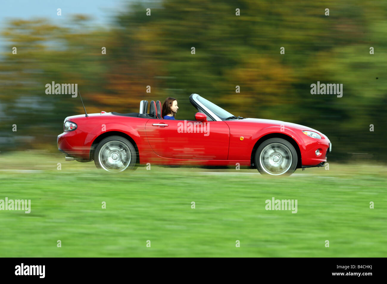 Mazda MX-5, model year 2005-, red, open top, driving, side view ...