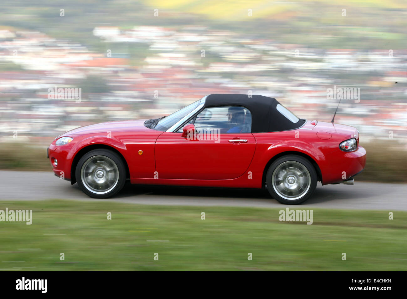 Mazda MX-5, model year 2005-, red, closed top, driving, side view ...