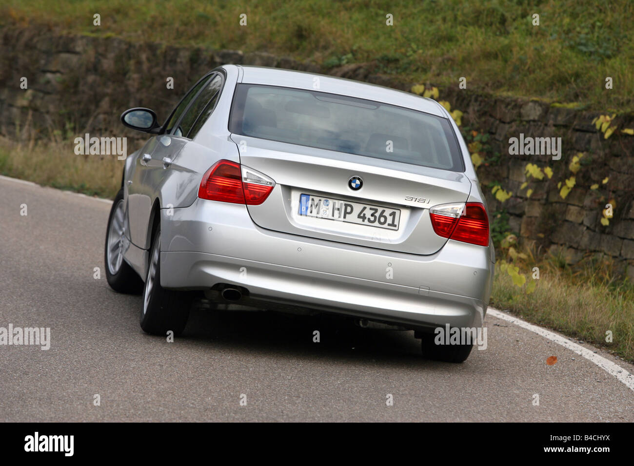 BMW 318i, model year 2004-, silver, driving, diagonal from the back ...