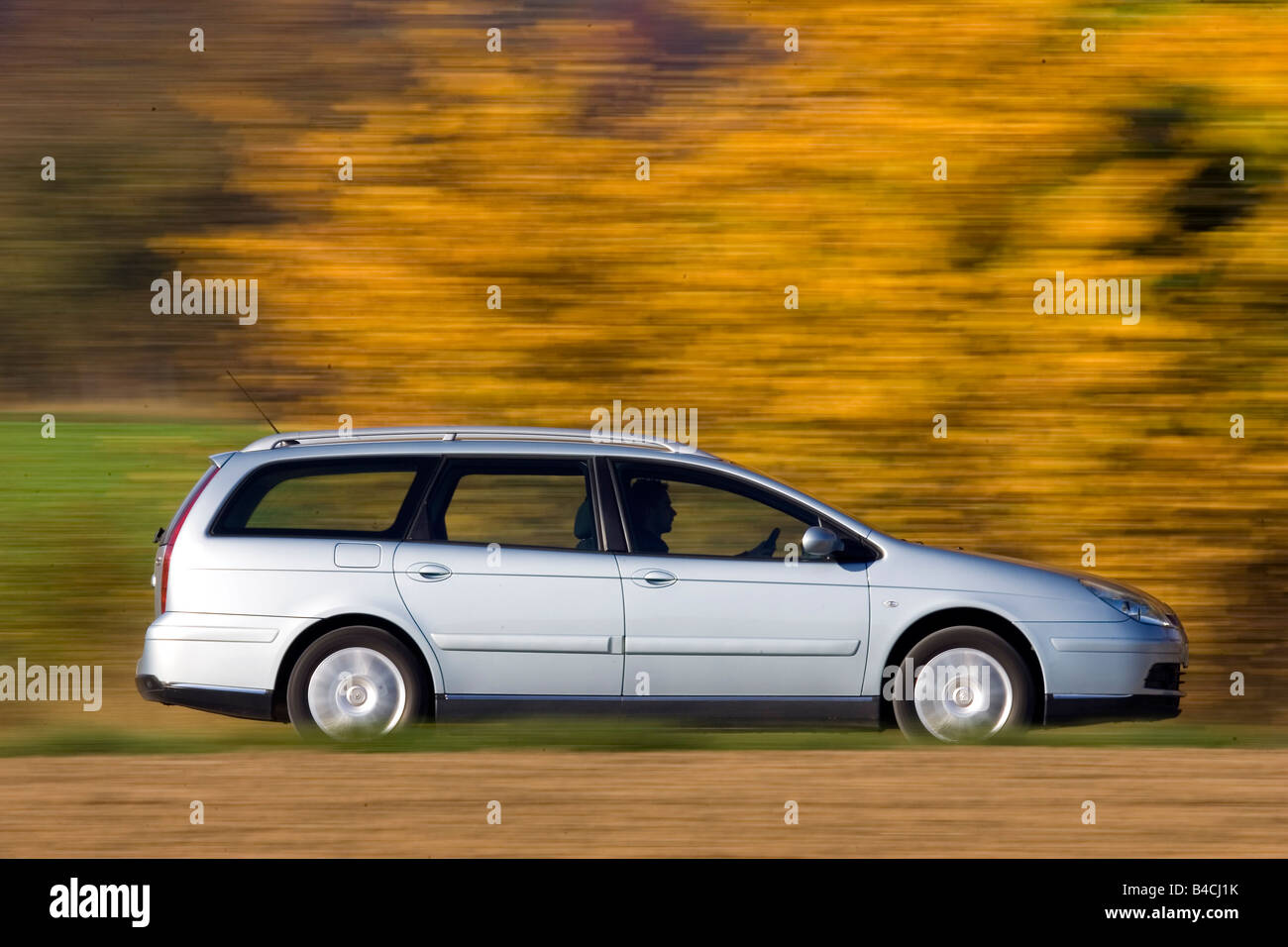 Citroen C5 hatchback HDi 110, silver, model year 2005-, driving, side ...
