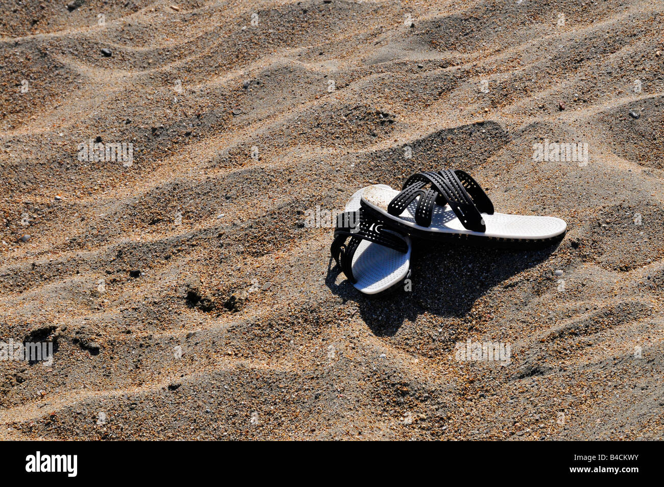 Shoes left on the beach hi-res stock photography and images - Alamy