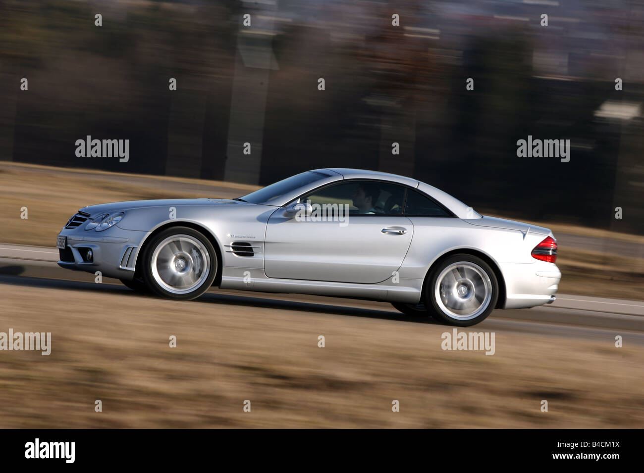 Mercedes SL 55 AMG, model year 2006-, silver, driving, side view ...