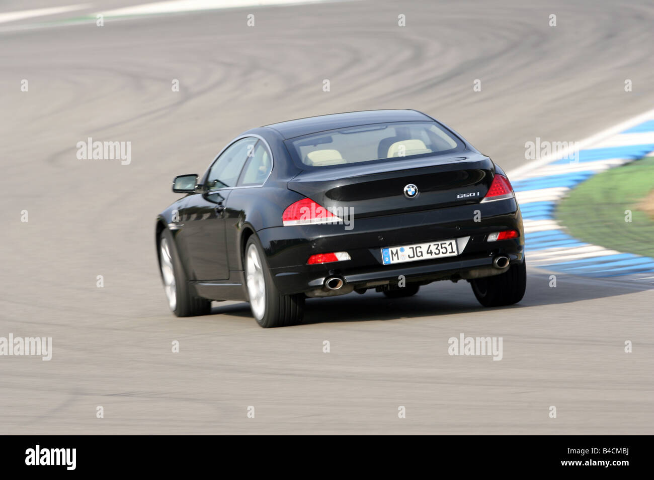 BMW 650i, model year 2006-, black, driving, diagonal from the back ...