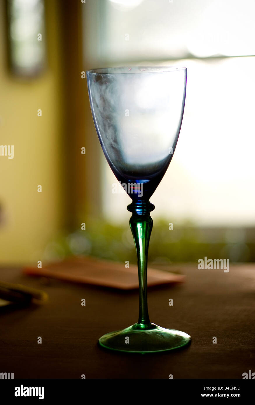a wine glass with grubby paw marks from the night before Stock Photo ...