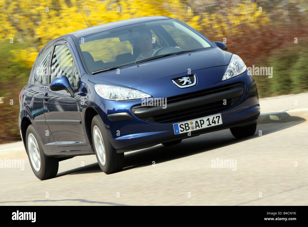 Peugeot 207, model year 2006-, dunkelblue moving, diagonal from the ...