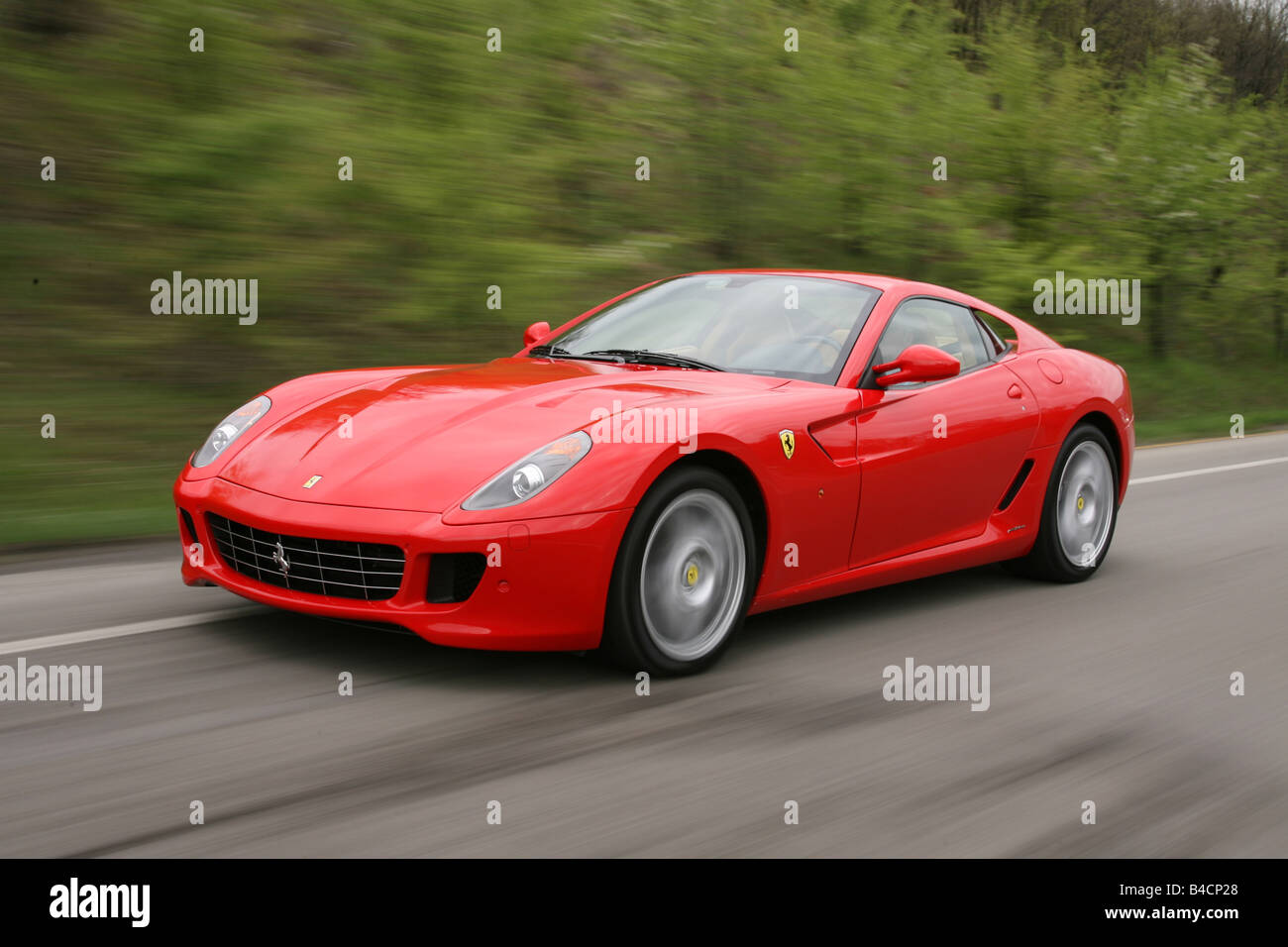 Ferrari 599 GTB, model year 2006-, red, driving, diagonal from the ...