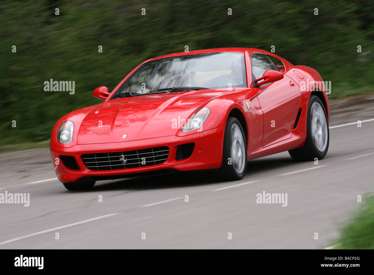Ferrari 599 GTB, model year 2006-, red, driving, diagonal from the ...
