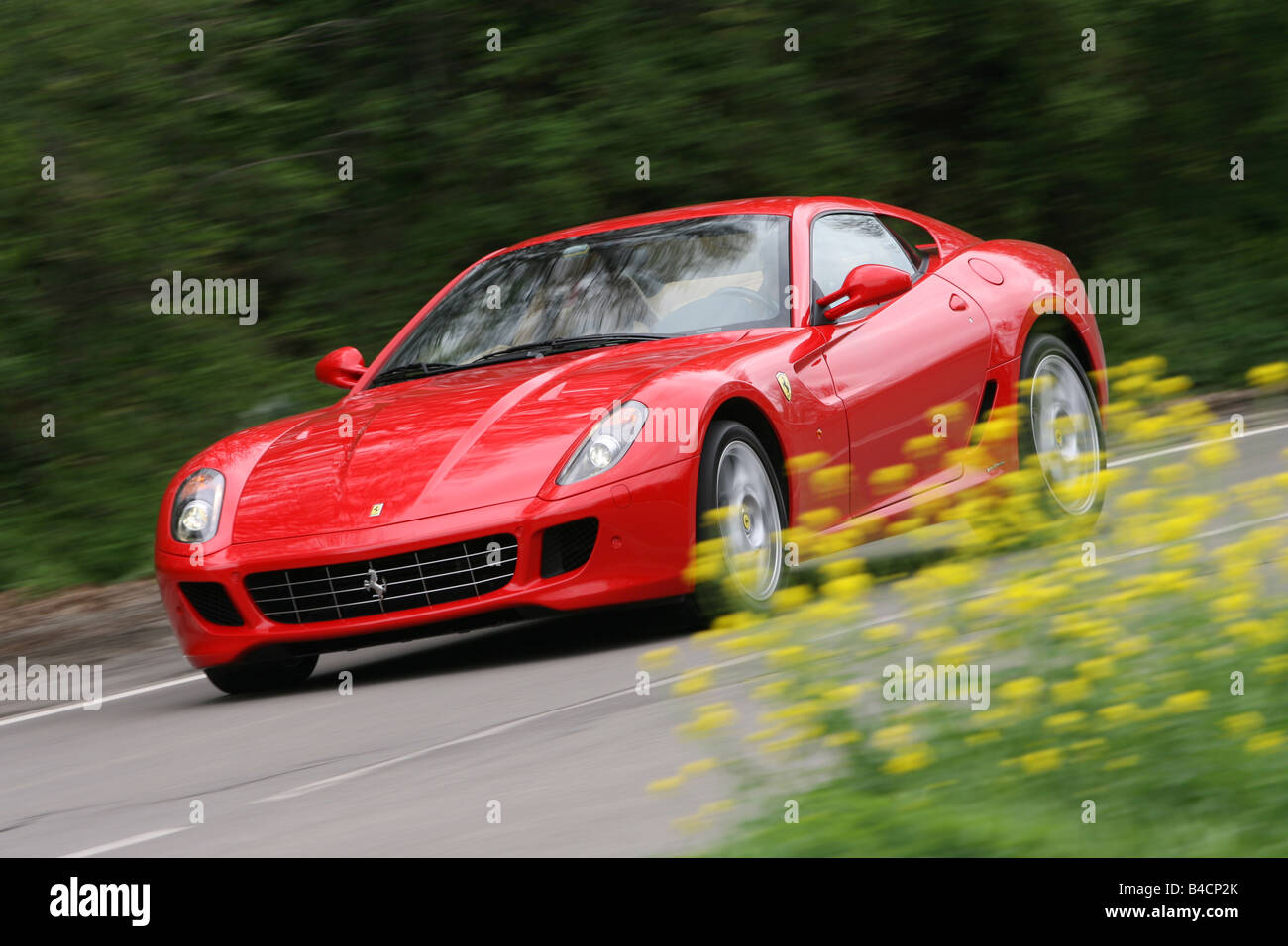 Ferrari 599 GTB, model year 2006-, red, driving, diagonal from the ...