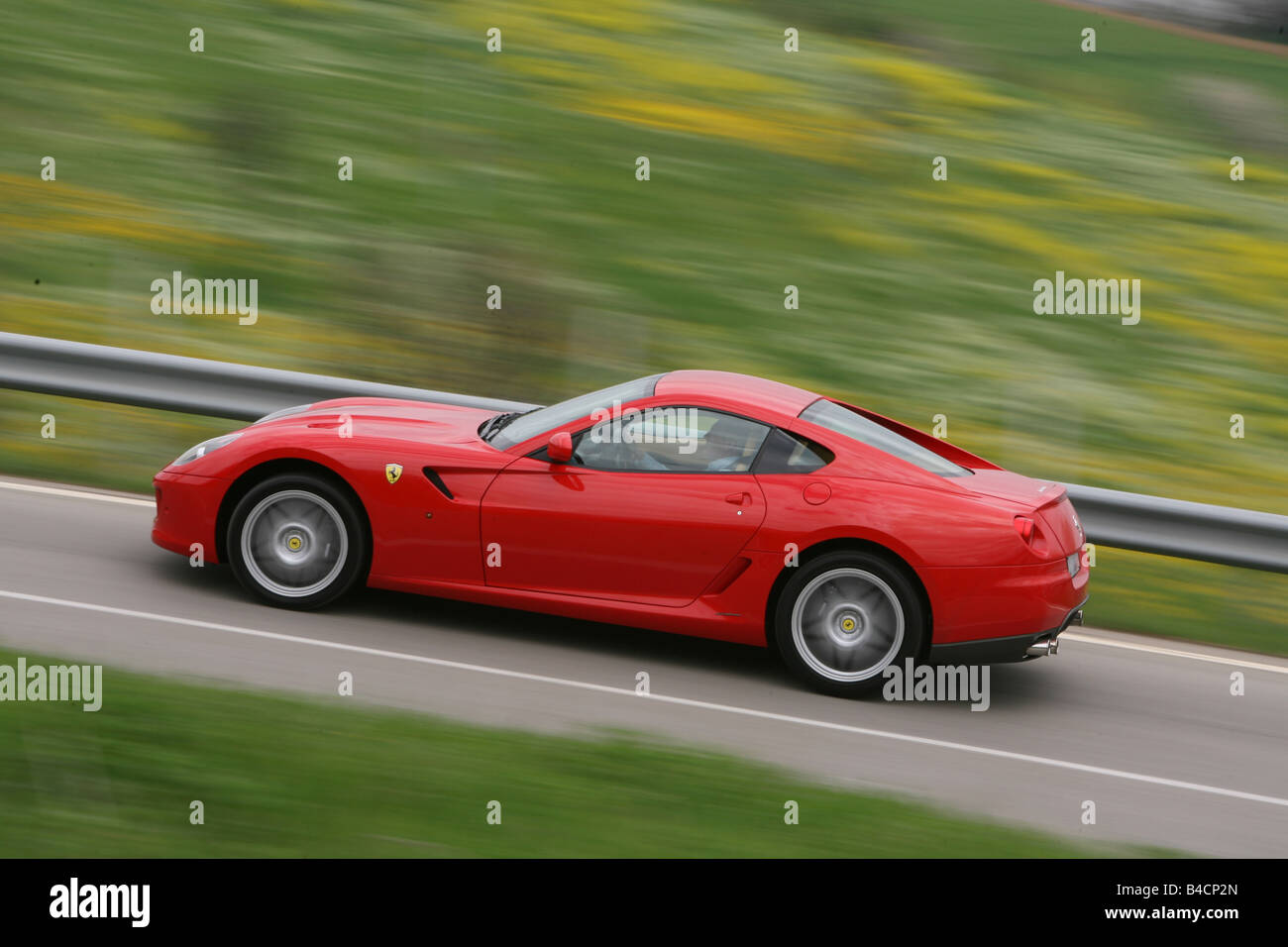 Ferrari 599 GTB, model year 2006-, red, driving, side view, country ...