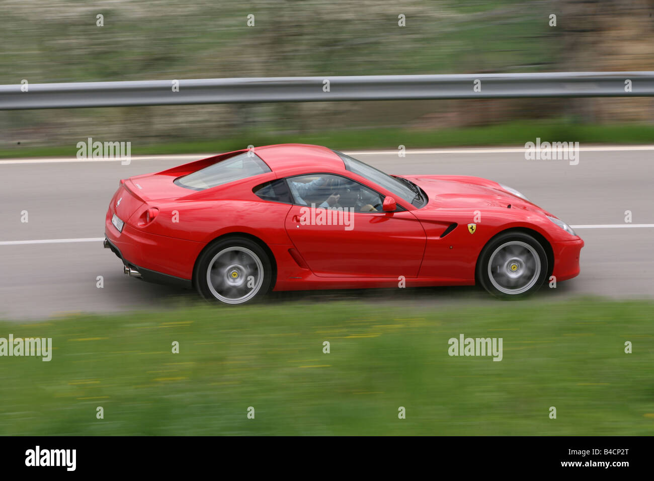 Ferrari 599 GTB, model year 2006-, red, driving, side view, country ...
