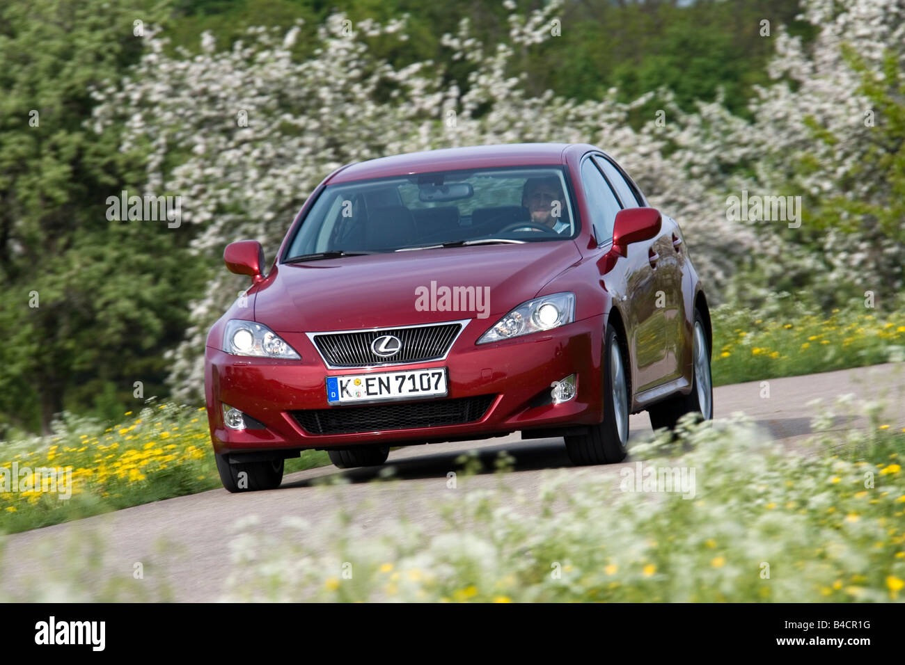 Lexus IS 220d, model year 2006-, red, driving, diagonal from the front ...